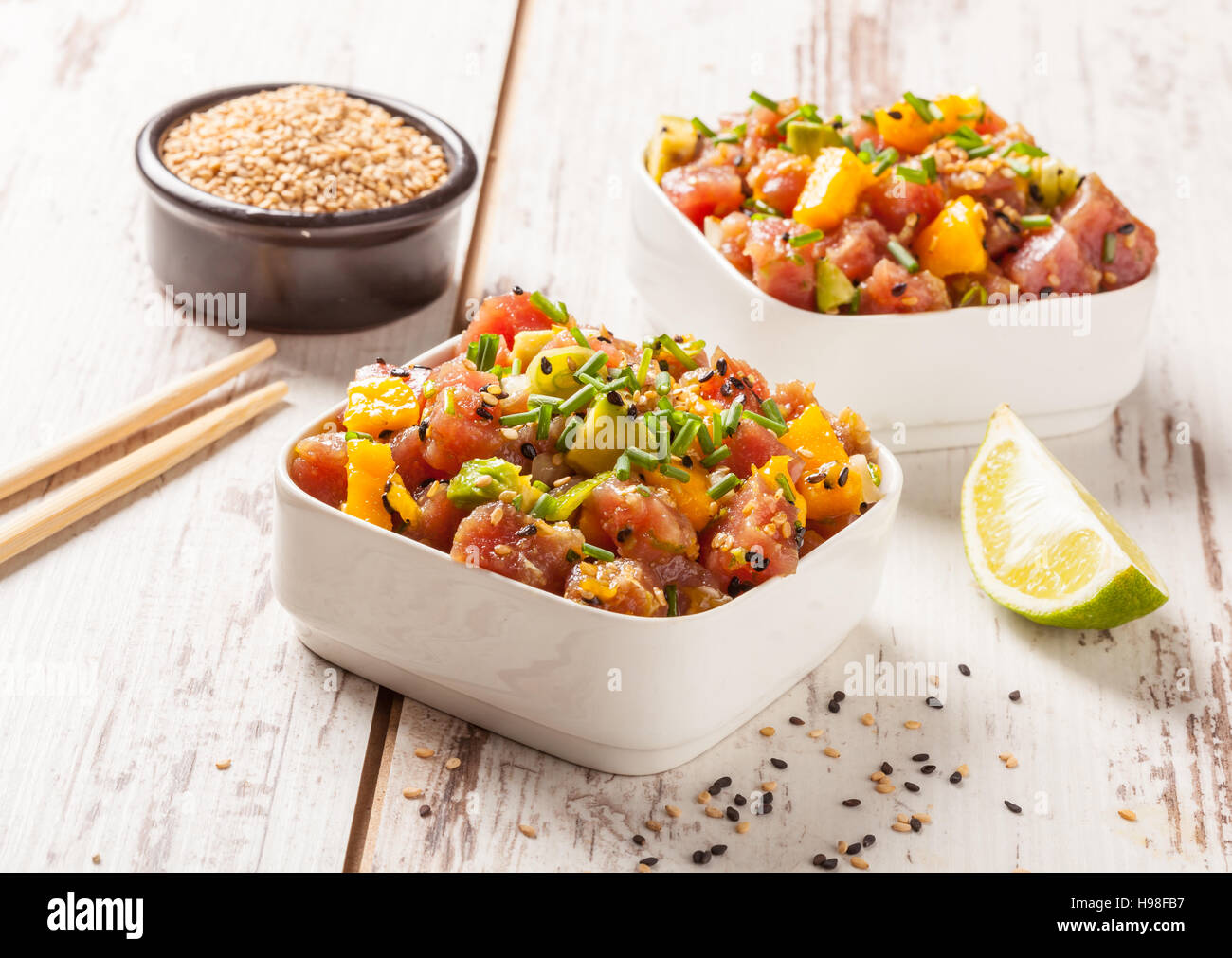 Hawaiian tuna poke with mango, avocado, onion and sesame seeds Stock ...
