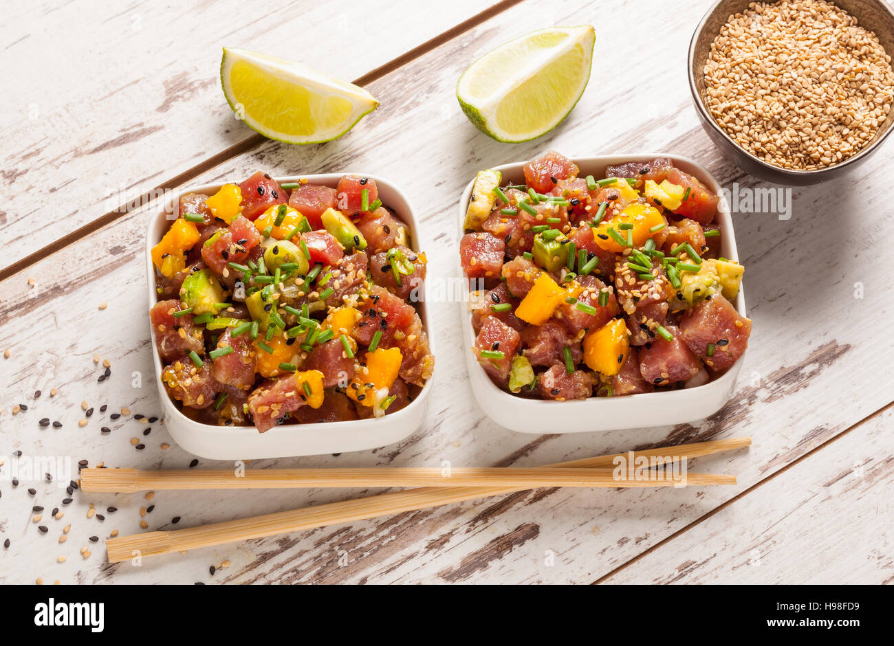 Hawaiian tuna poke with mango, avocado, onion and sesame seeds Stock ...