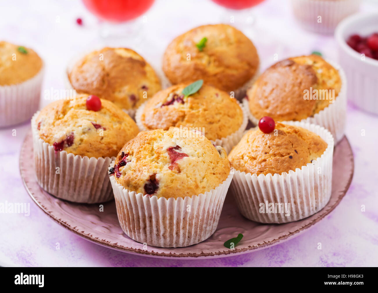 Tasty muffin (cupcake) with cranberries Stock Photo - Alamy