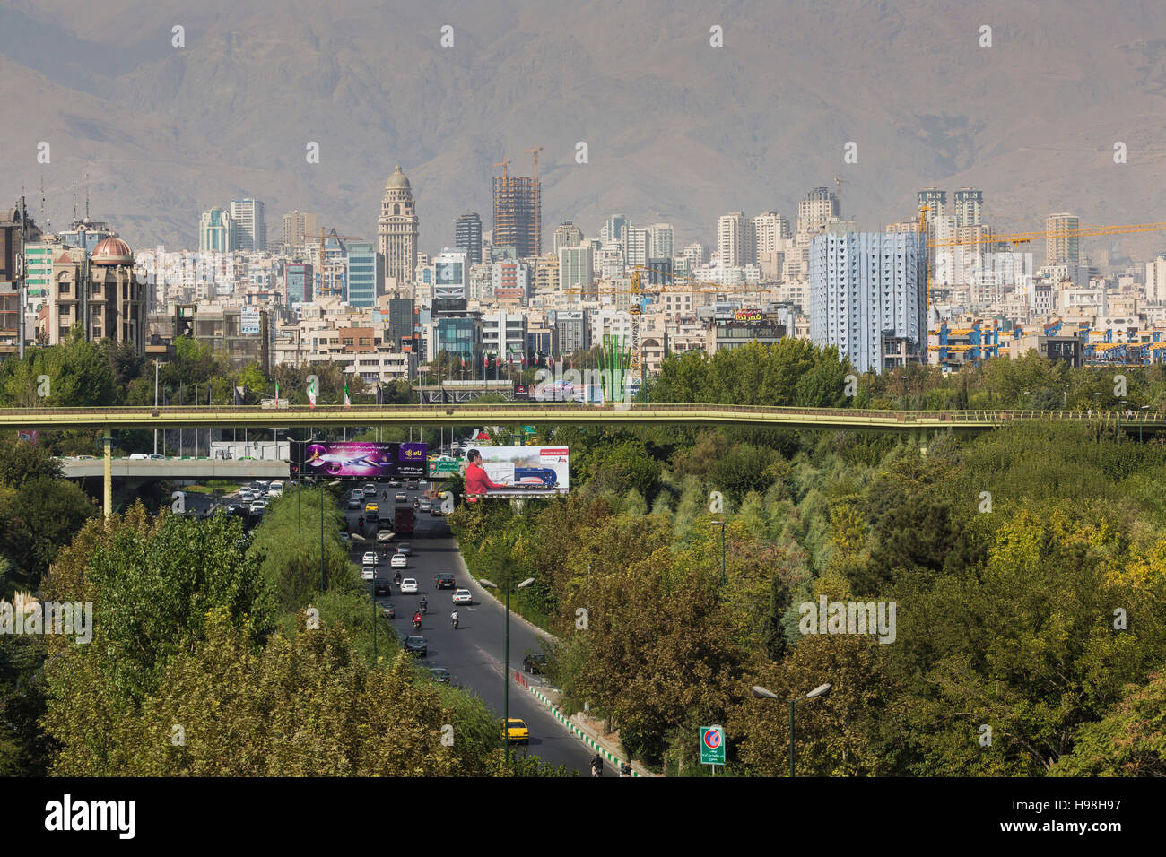TEHERAN, IRAN - OCTOBER 03, 2016:Tehran skyline and greenery in front ...