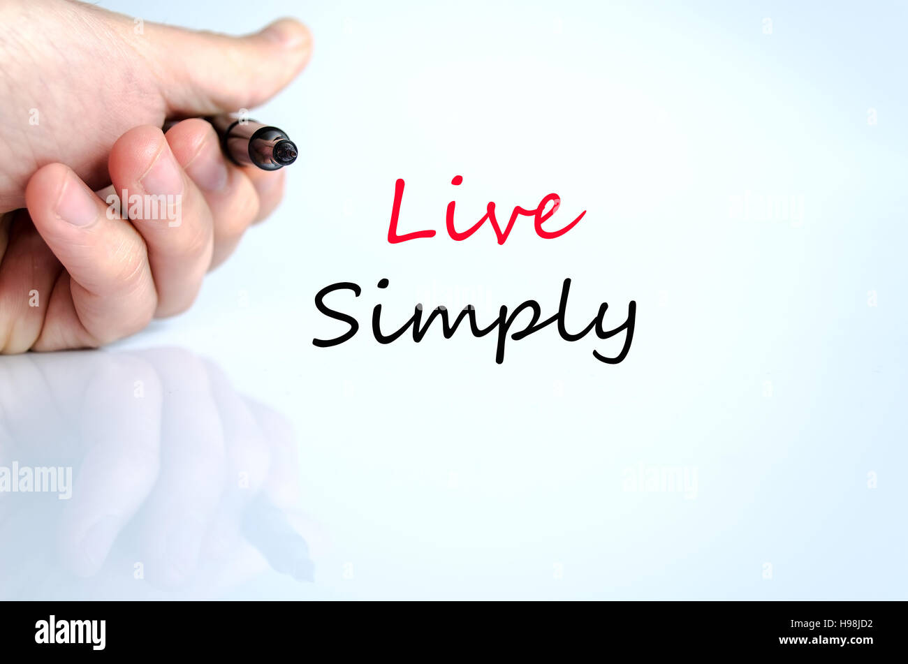 Live simply text concept isolated over white background Stock Photo - Alamy