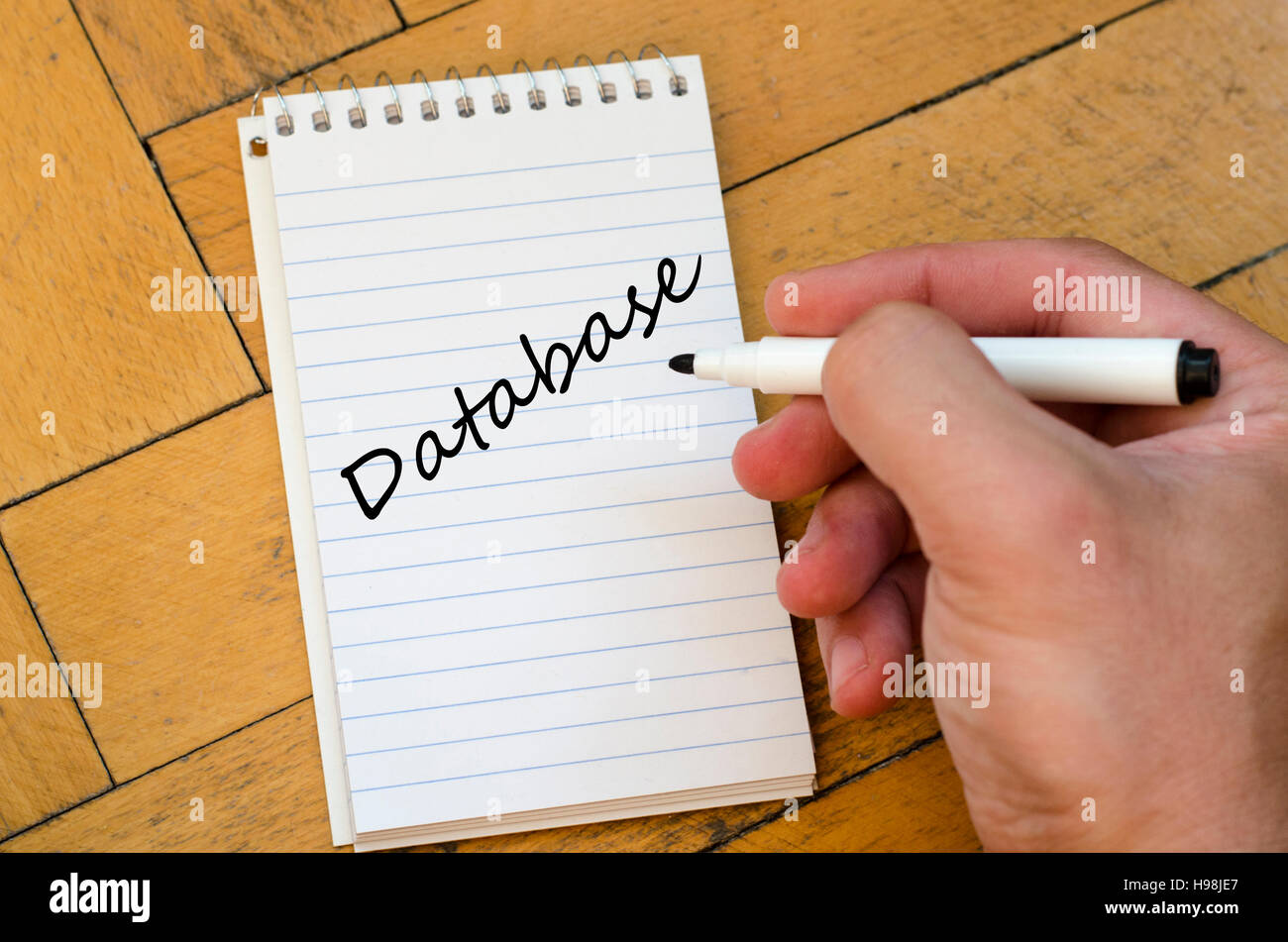 Database text concept write on notebook Stock Photo - Alamy