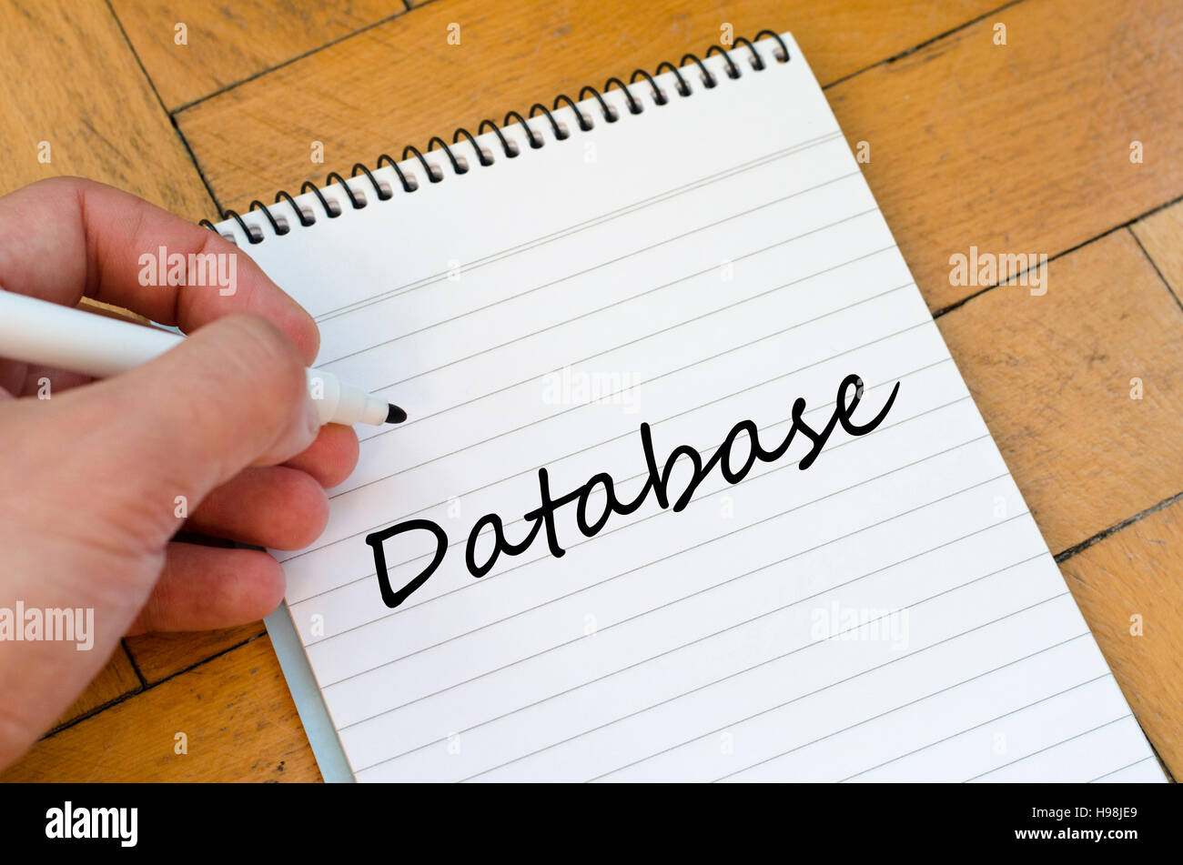 Database text concept write on notebook Stock Photo - Alamy