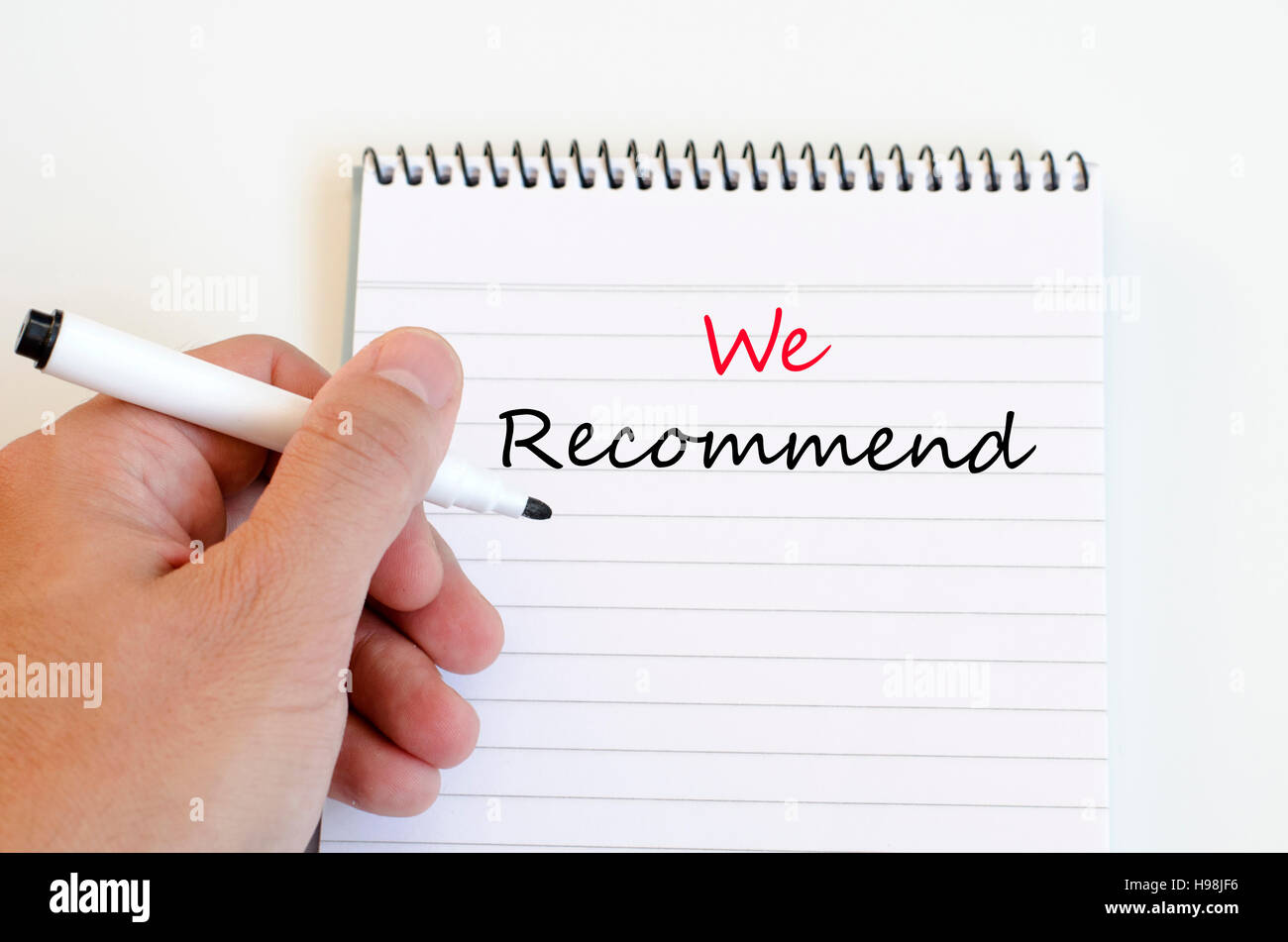 We recommend text concept write on notebook Stock Photo - Alamy