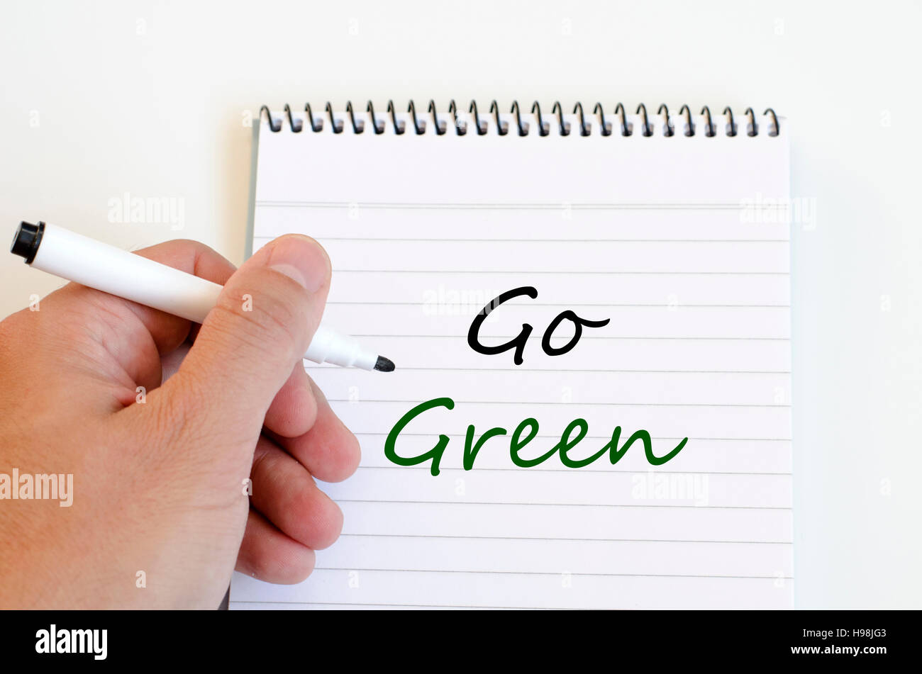Go green text concept write on notebook Stock Photo - Alamy
