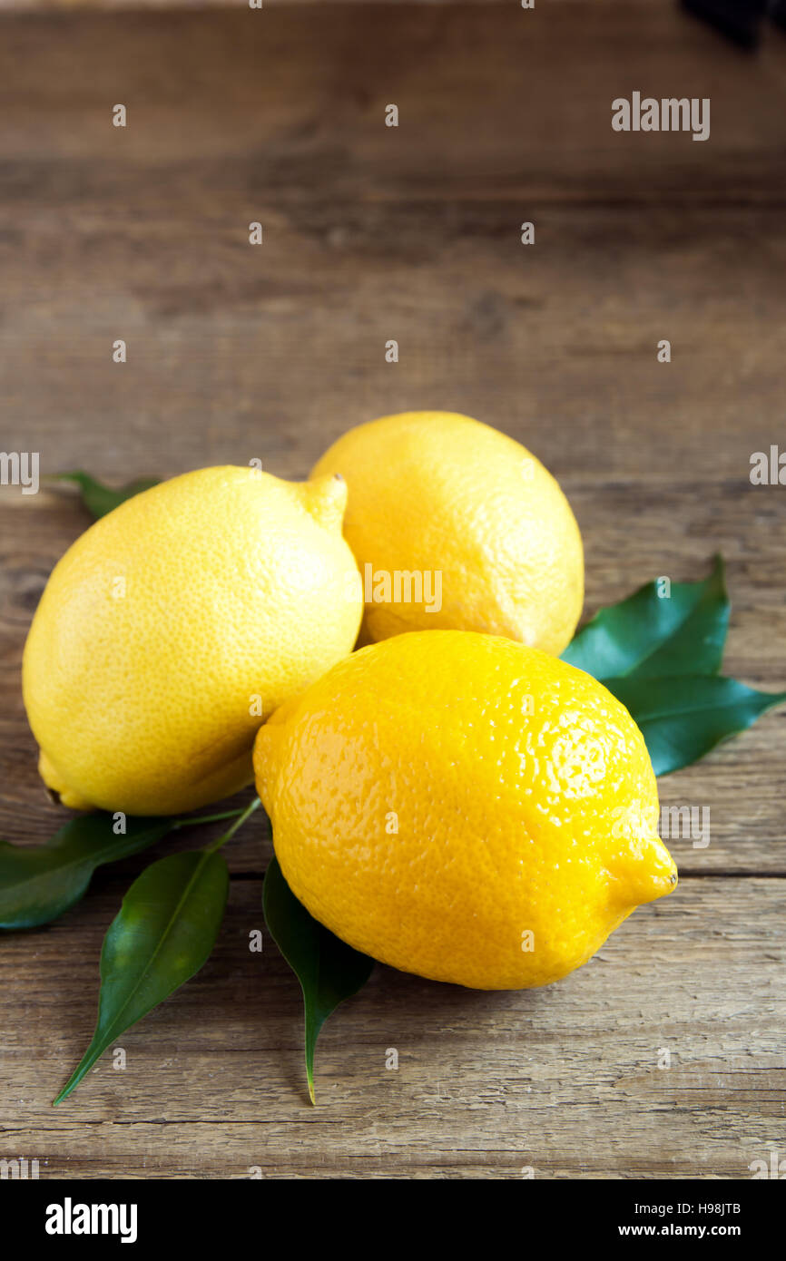 Fresh organic lemons on rustic wooden background with copy space Stock ...