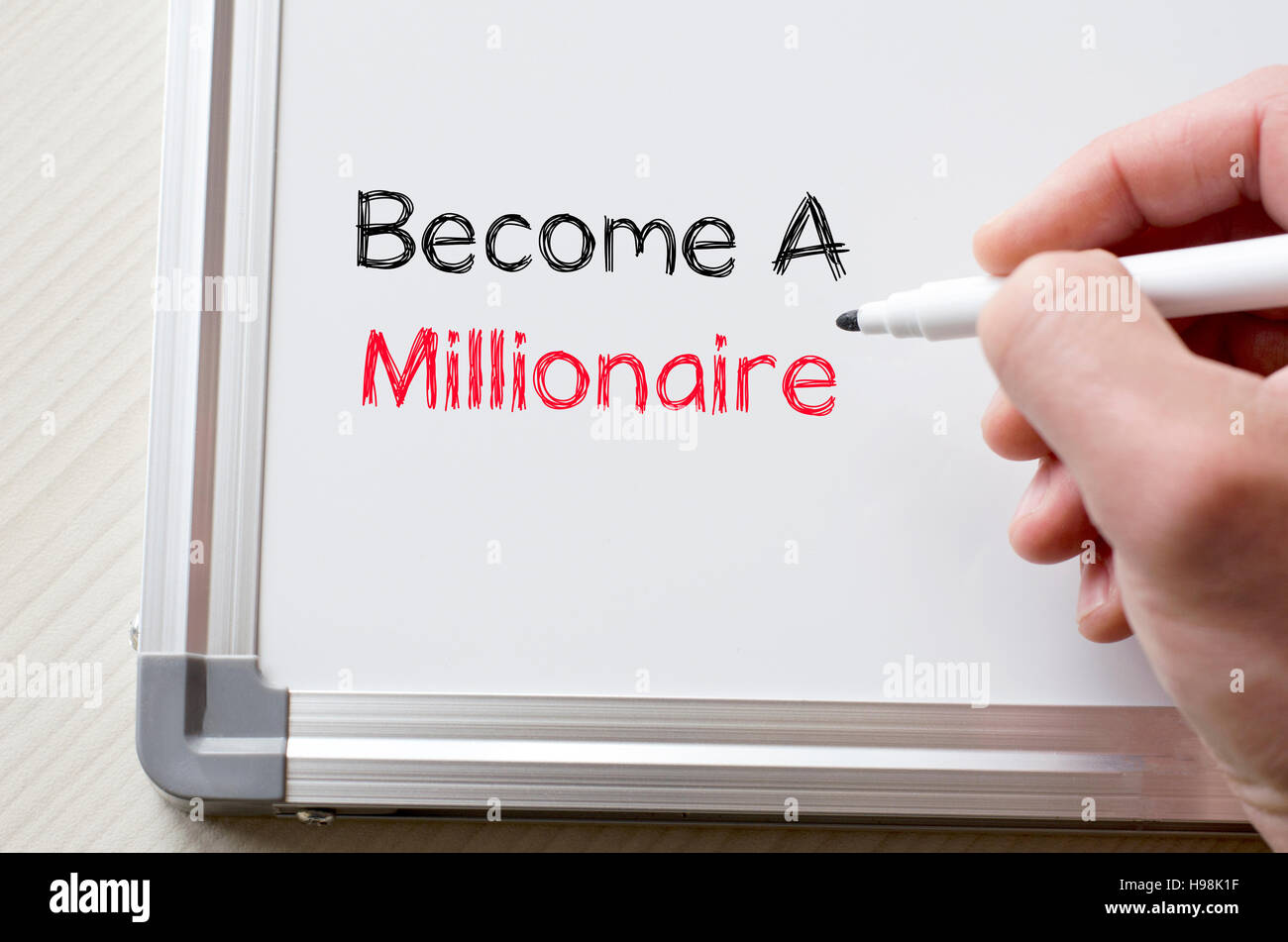 Human hand writing become a millionaire on whiteboard Stock Photo - Alamy