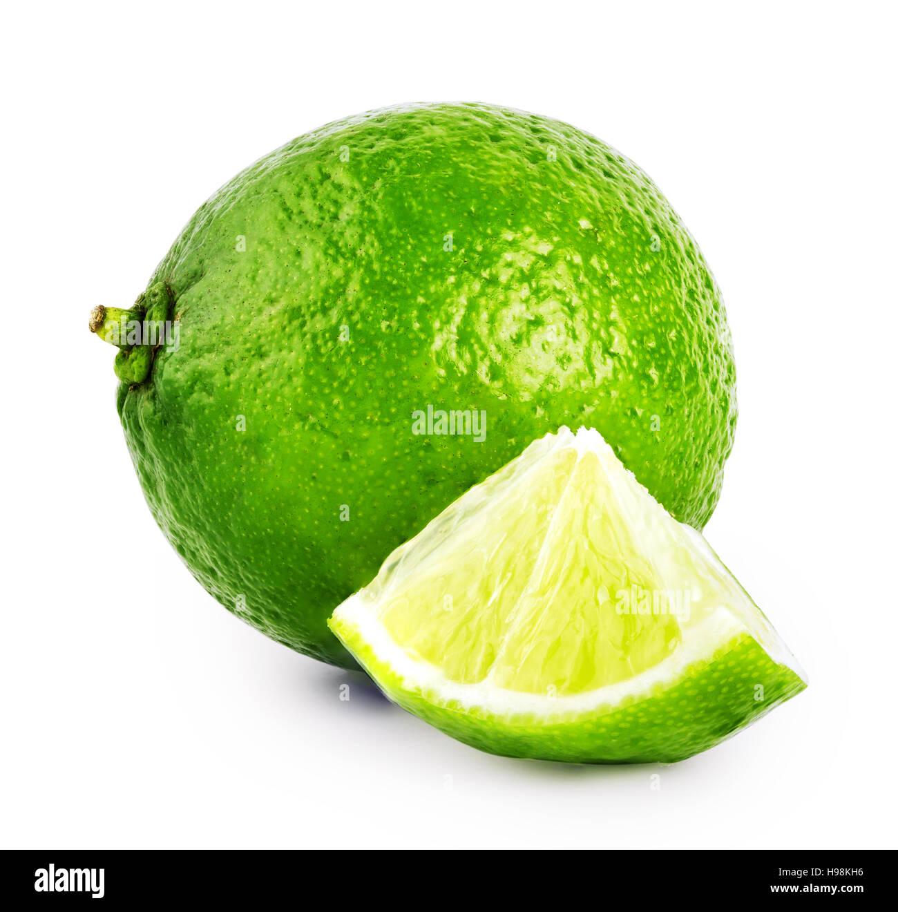 Whole and slice sour lime isolated on white background Stock Photo - Alamy