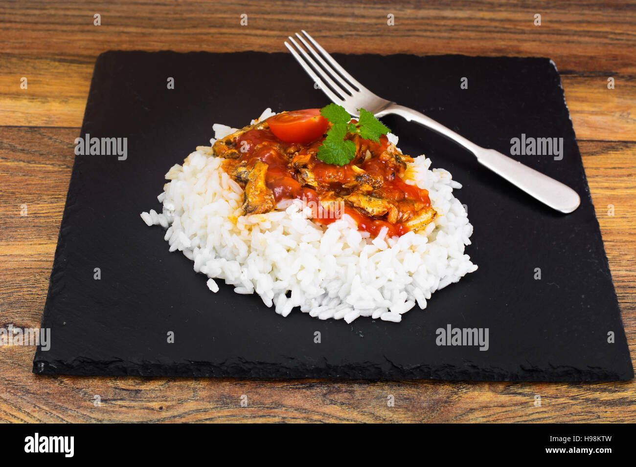 Rice with Canned Fish in Tomato Sauce Studio Photo Stock Photo - Alamy