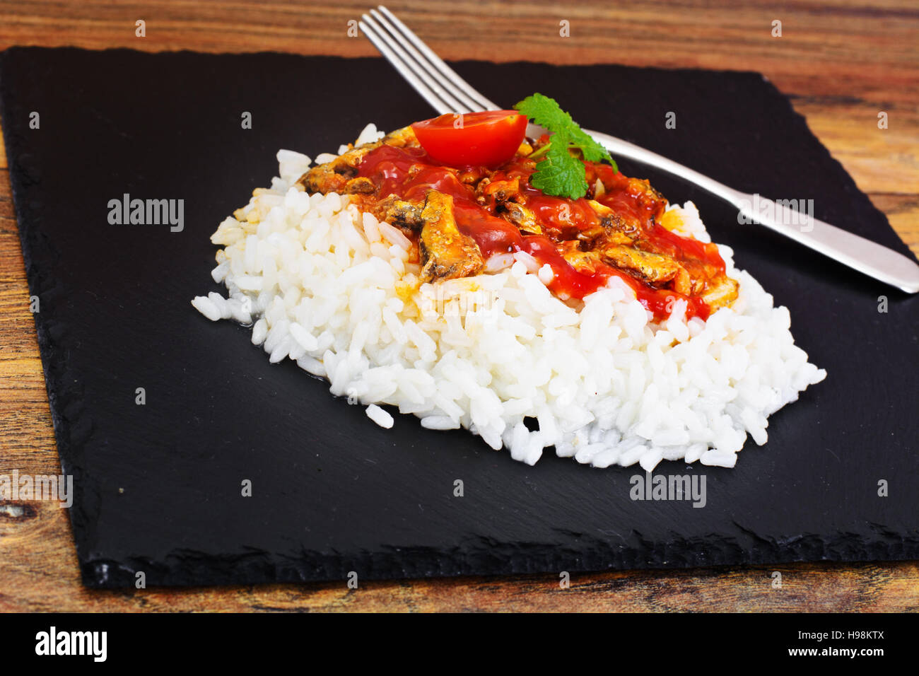 Rice with Canned Fish in Tomato Sauce Studio Photo Stock Photo - Alamy