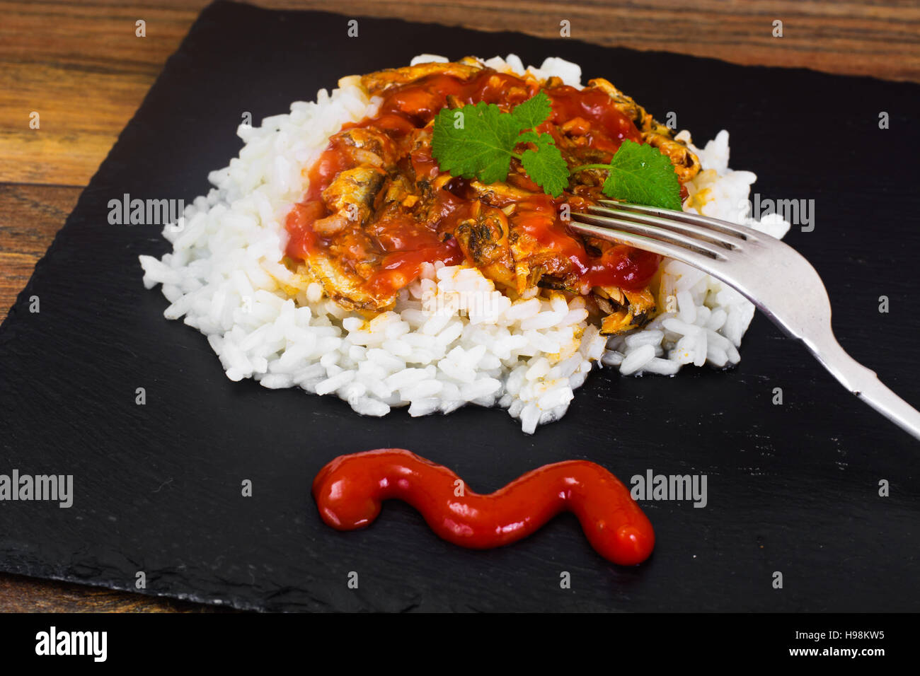 Rice with Canned Fish in Tomato Sauce Studio Photo Stock Photo - Alamy