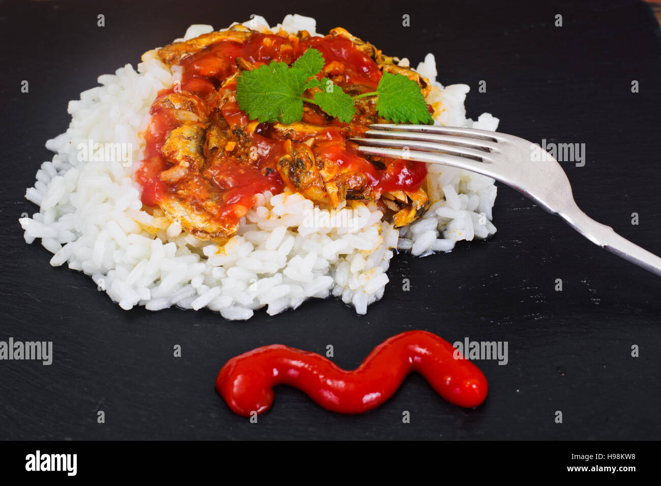 Rice with Canned Fish in Tomato Sauce Studio Photo Stock Photo - Alamy
