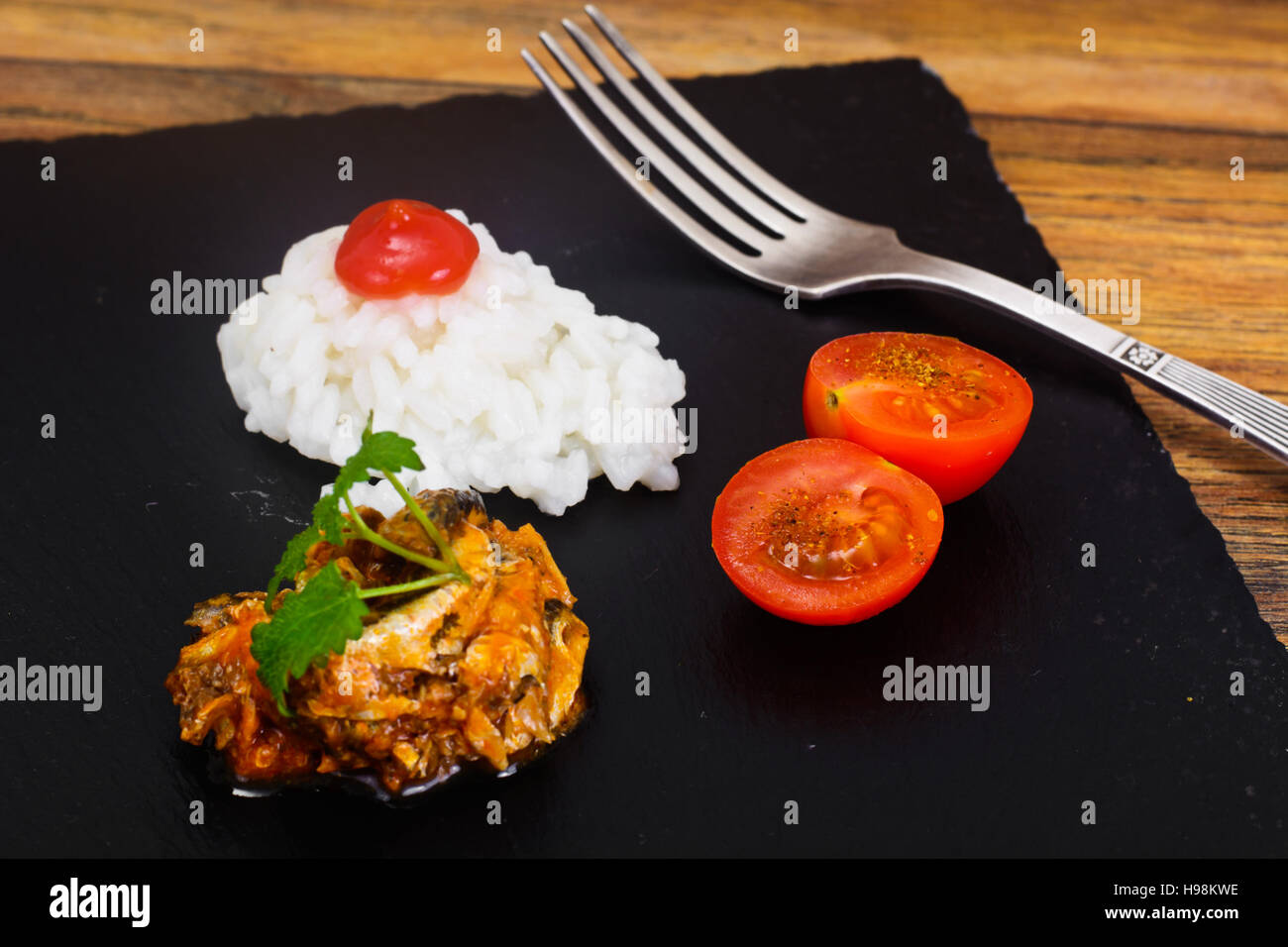 Rice with Canned Fish in Tomato Sauce Studio Photo Stock Photo - Alamy