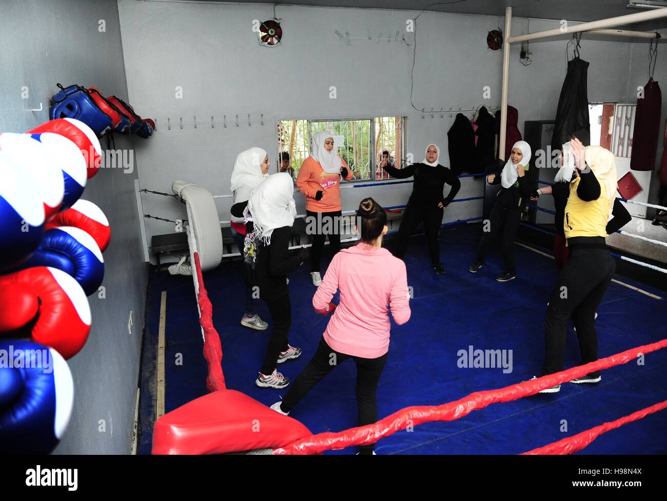 Damascus, Syria. 19th Nov, 2016. Syrian women boxers warm up before ...