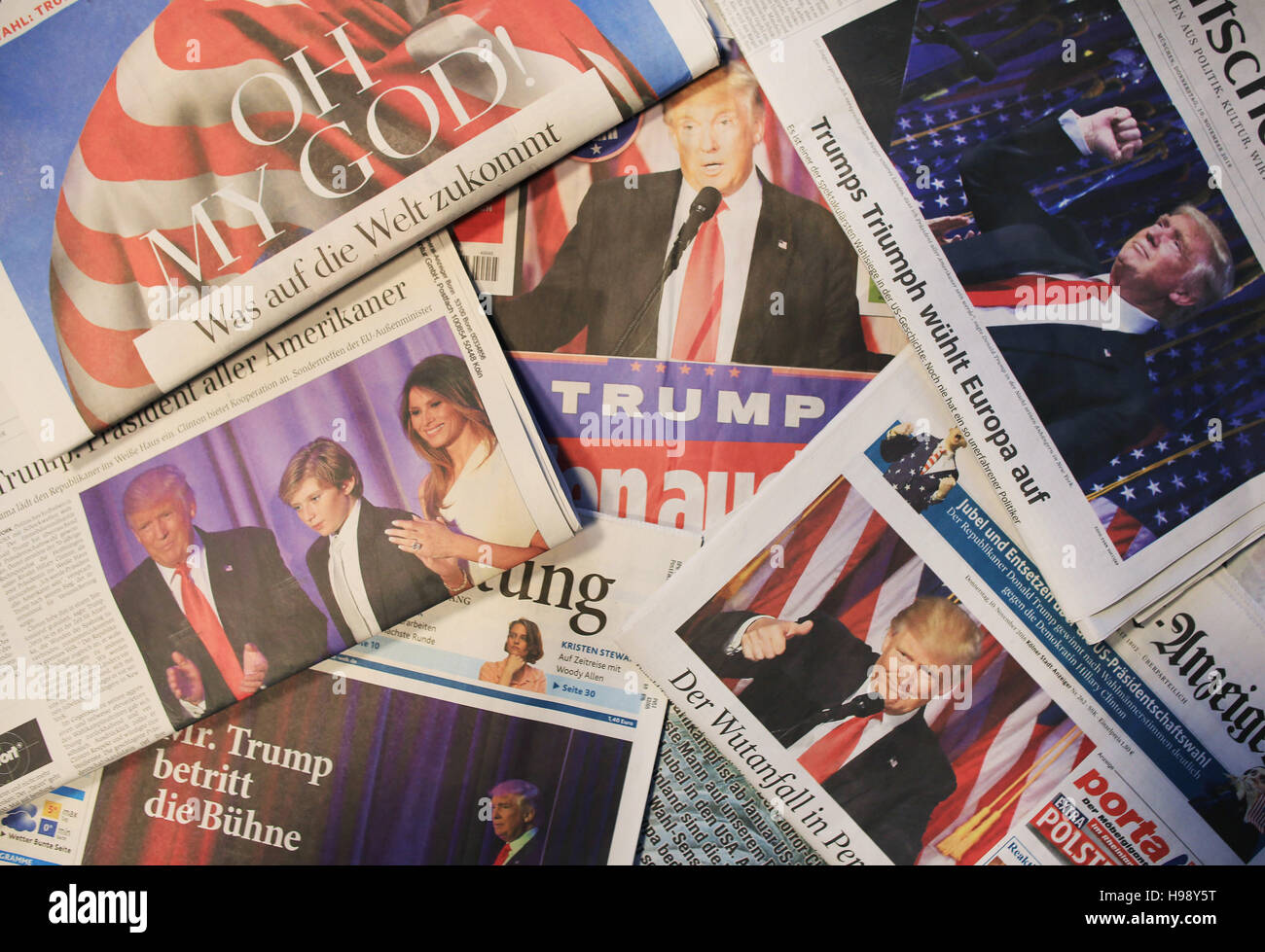 Newpapers with titles on the US election and the victory of Donald ...
