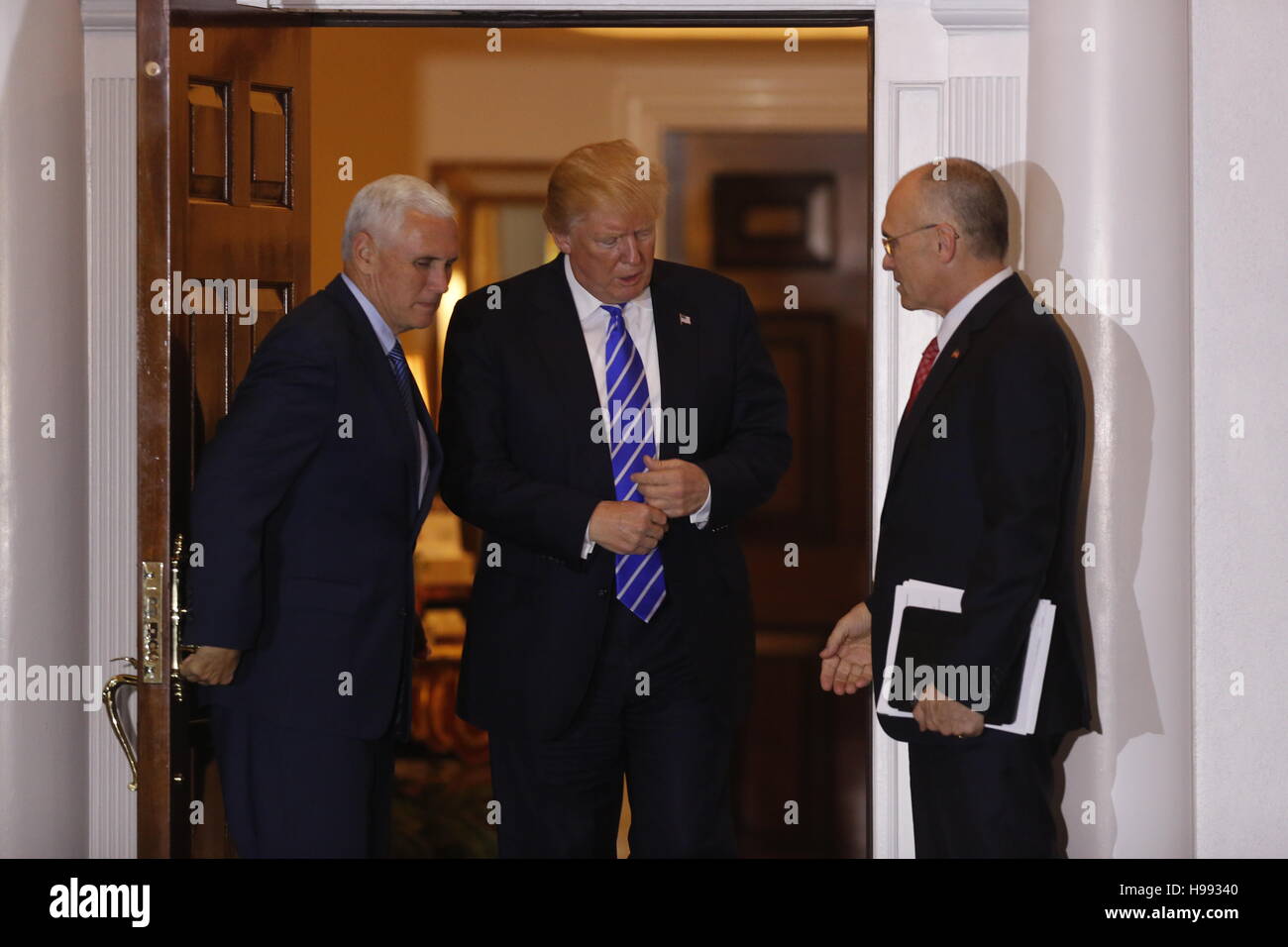 Andrew Puzder (R), chief executive of CKE Restaurants, leaves the ...