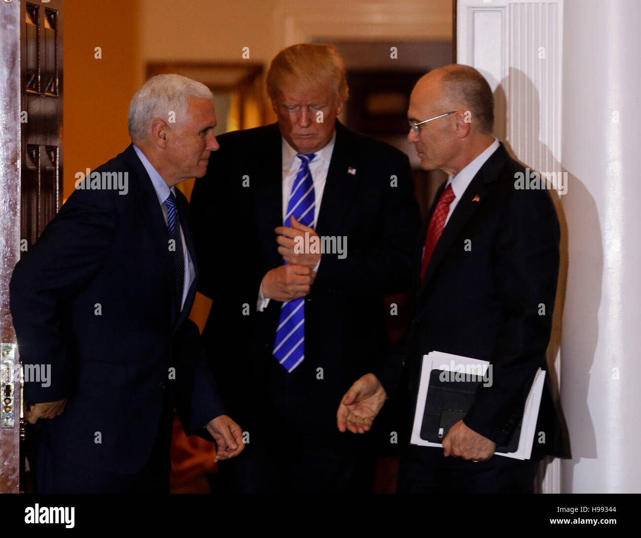 Andrew Puzder (R), chief executive of CKE Restaurants, leaves the ...