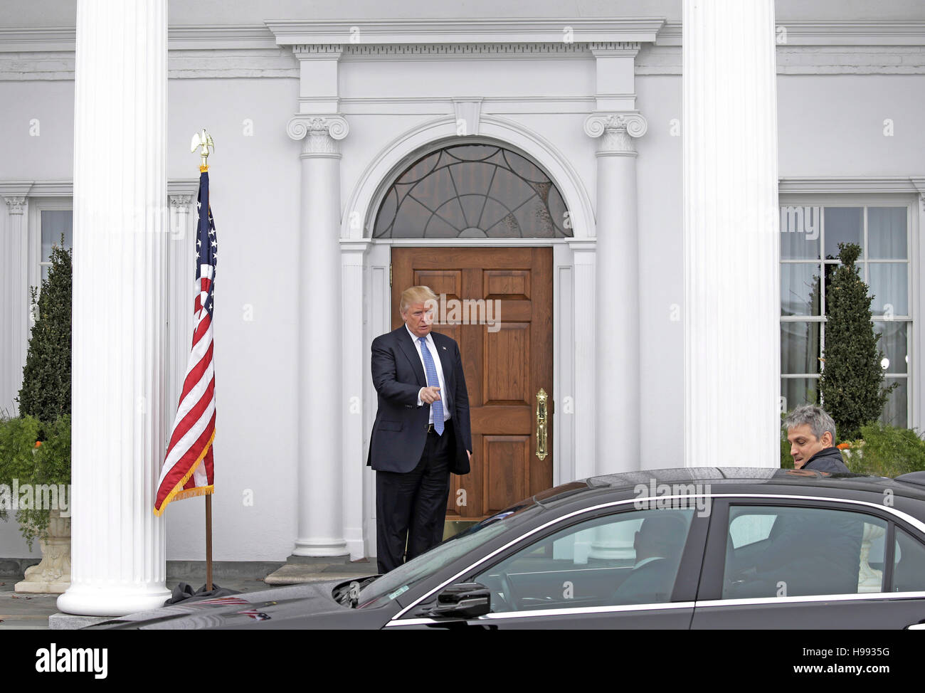 United States President-elect Donald Trump (L) gestures goodbye to Ari ...
