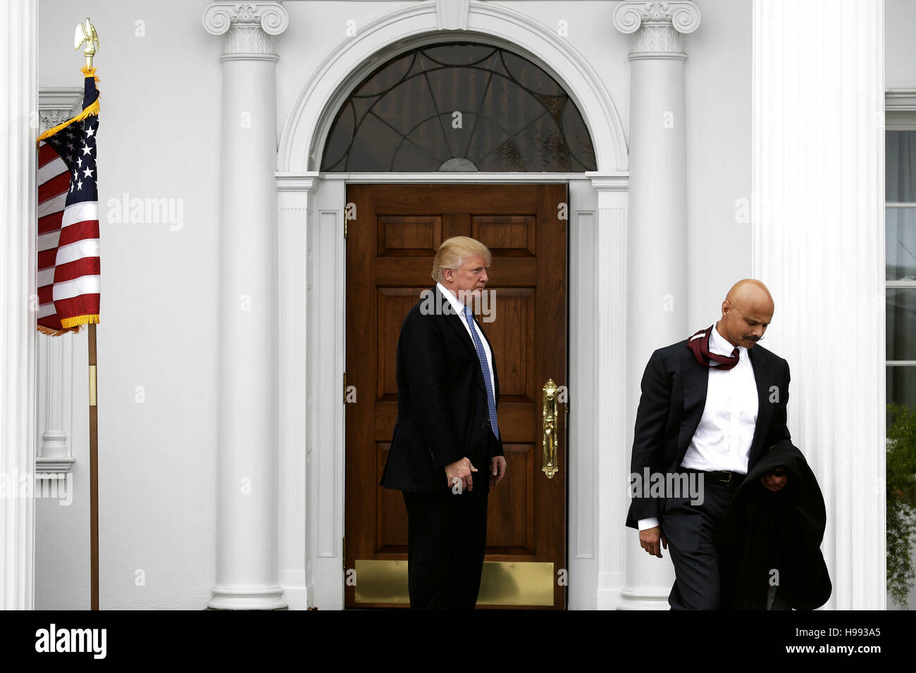 United States President-elect Donald Trump (C) sees off Peter Kirsanow ...