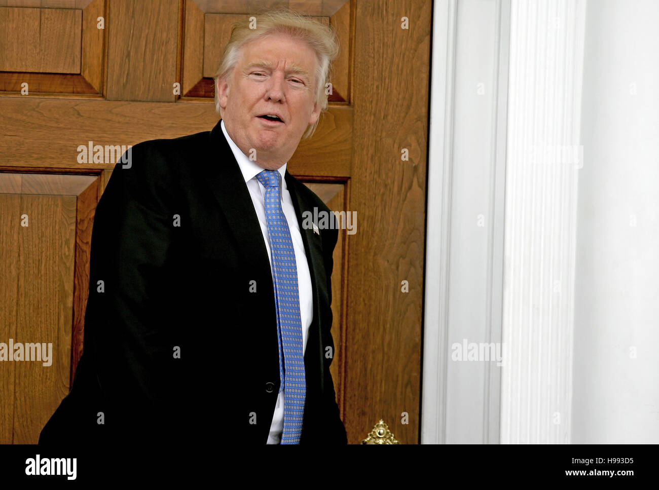 United States President-elect Donald Trump speaks briefly to the media ...