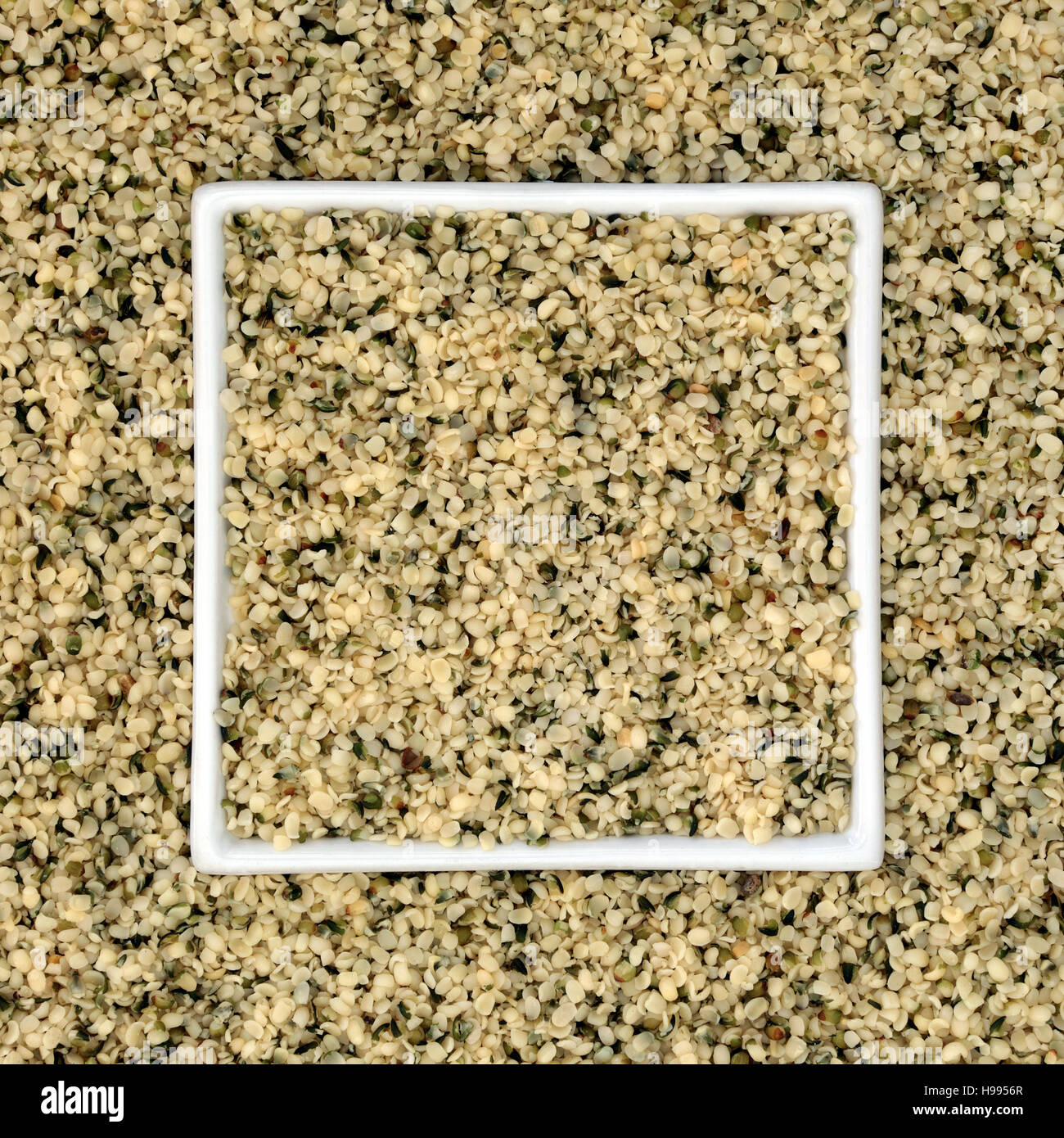 Hulled hemp seed superfood in a square shaped porcelain dish and ...