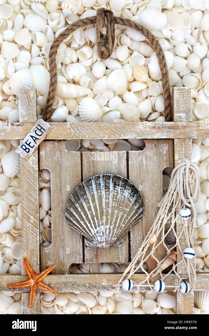 Rustic wooden beach sign on white seashell assortment Stock Photo - Alamy