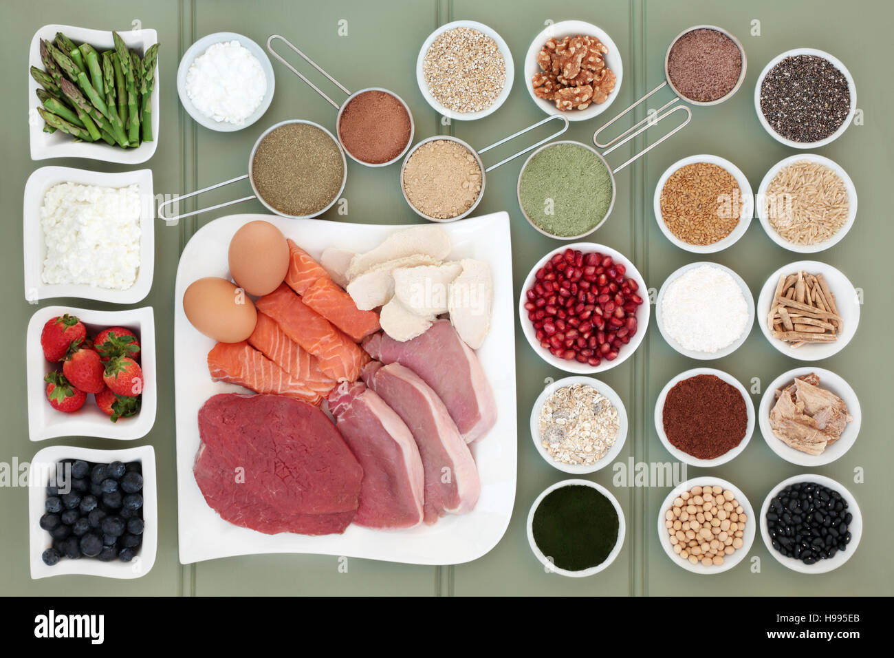 Healthy food for body builders with meat, salmon, supplement powders ...