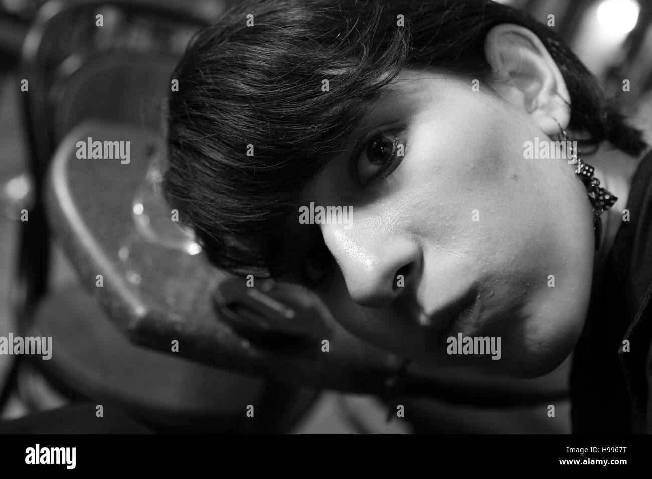 Girl looking at the camera lens Stock Photo - Alamy