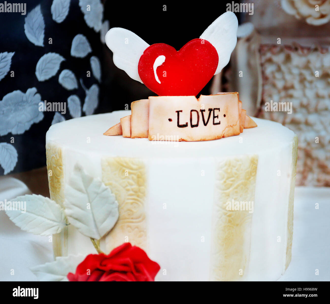 Beautiful cake with red heart and the words love Stock Photo - Alamy