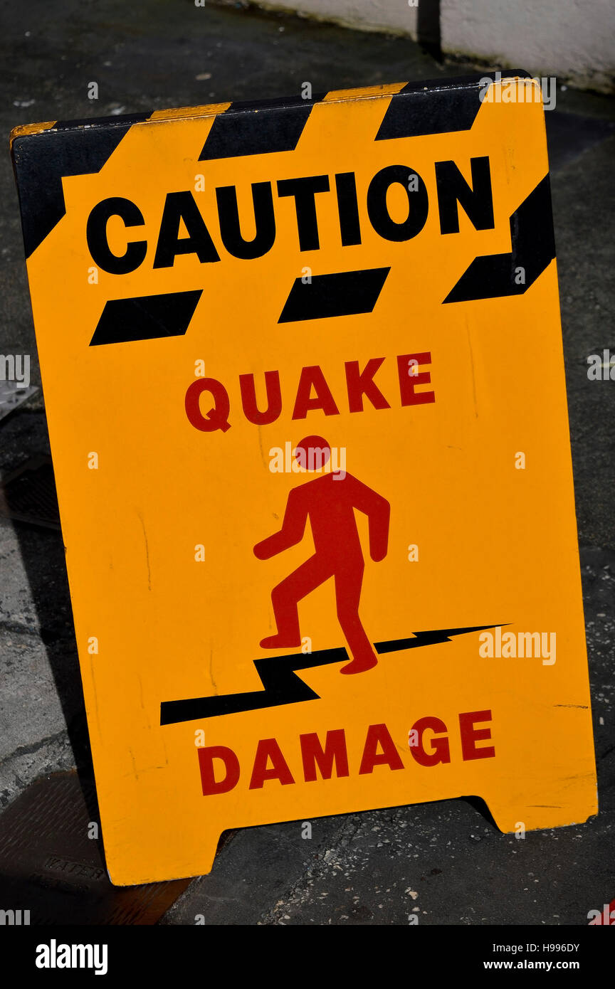 Caution earthquake damage sign Stock Photo - Alamy