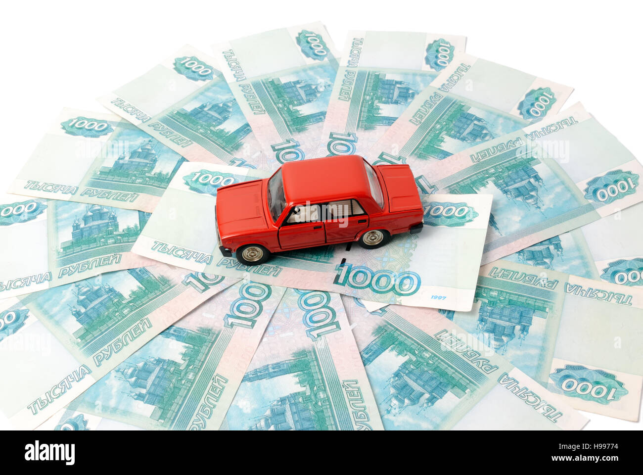 Toy car on the background of banknotes Stock Photo - Alamy