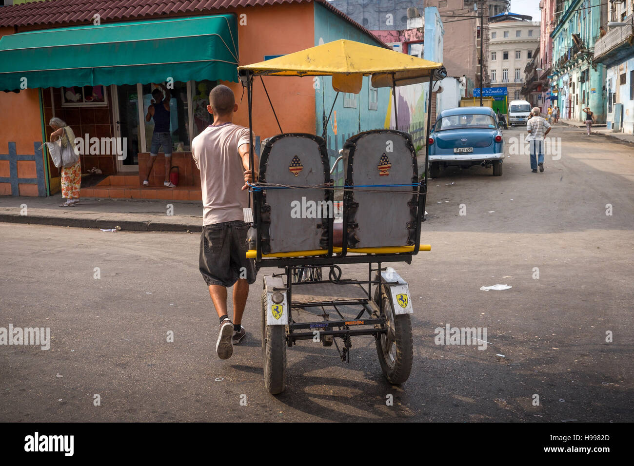 Havana, Cuba: Bicitaxi in a street scene, Old Havana Stock Photo - Alamy