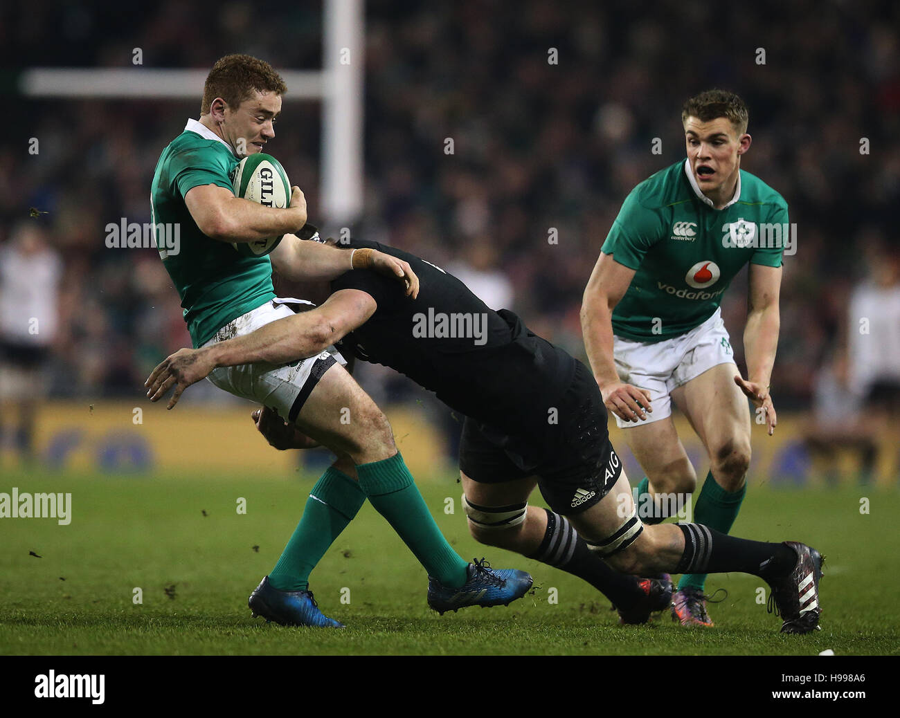 Ireland's Paddy Jackson and New Zealand's Brodie Retallick during the ...
