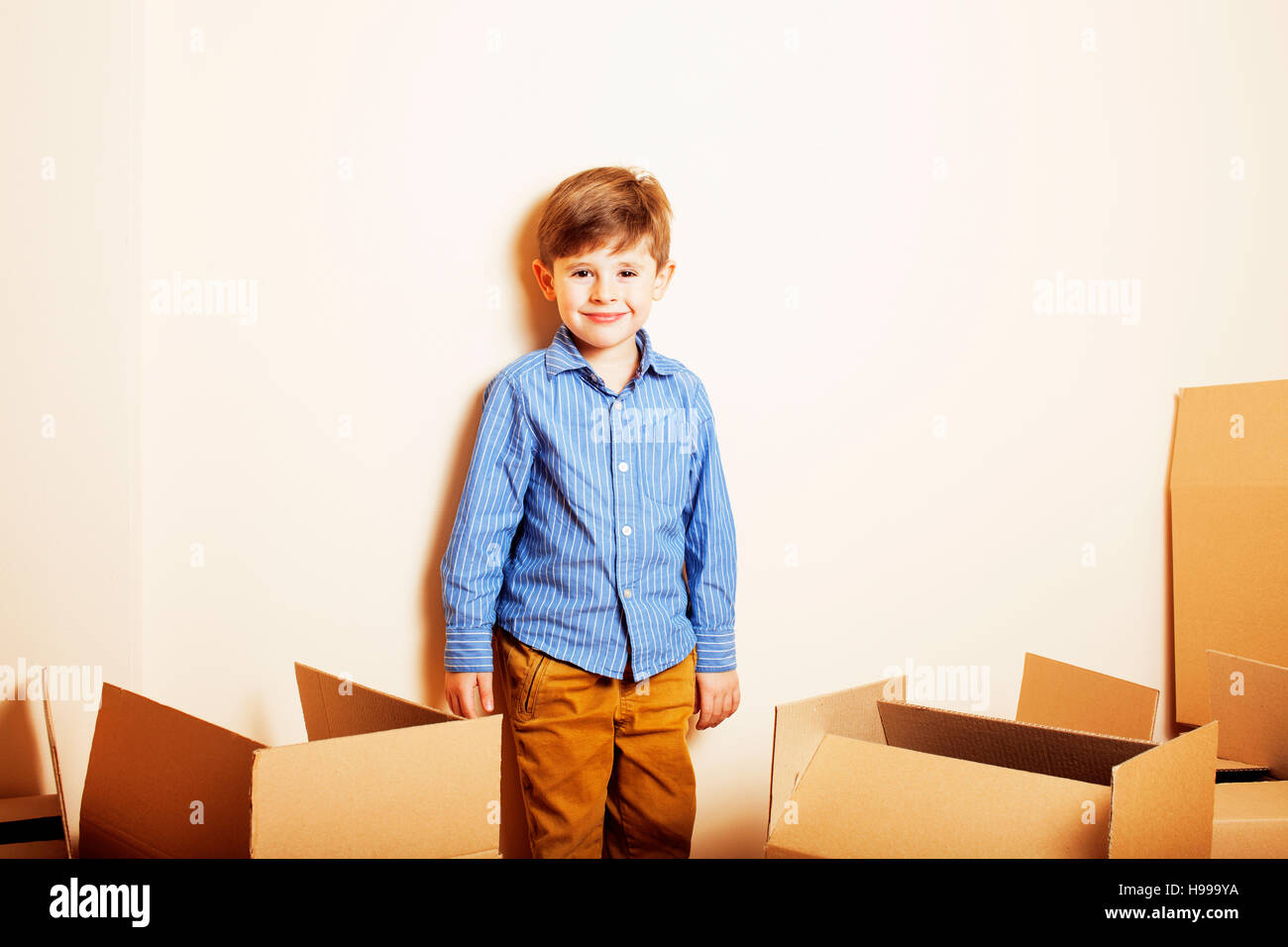 little cute boy in empty room, remoove to new house. home alone Stock ...