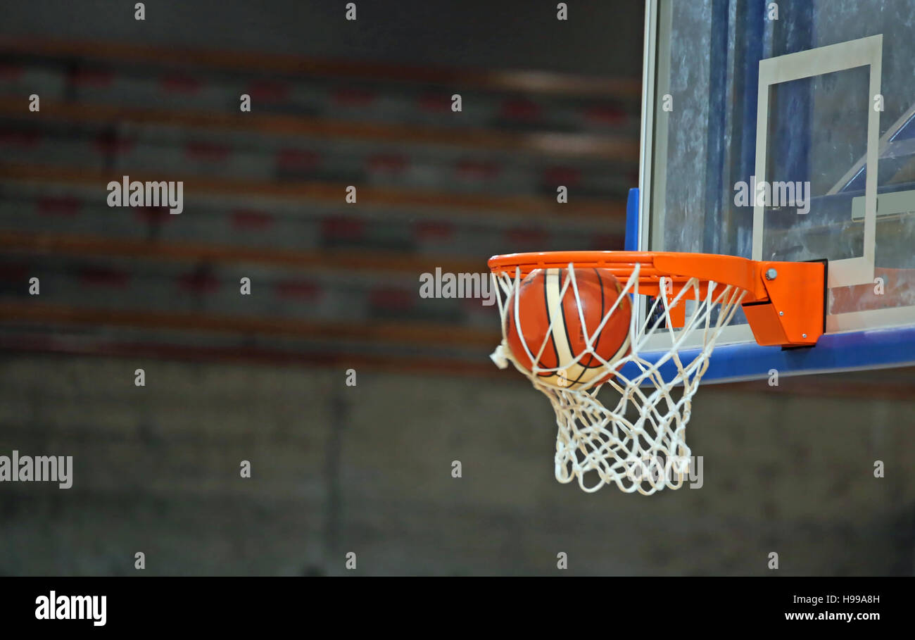basketball while enters in the basket during basketball game in the ...