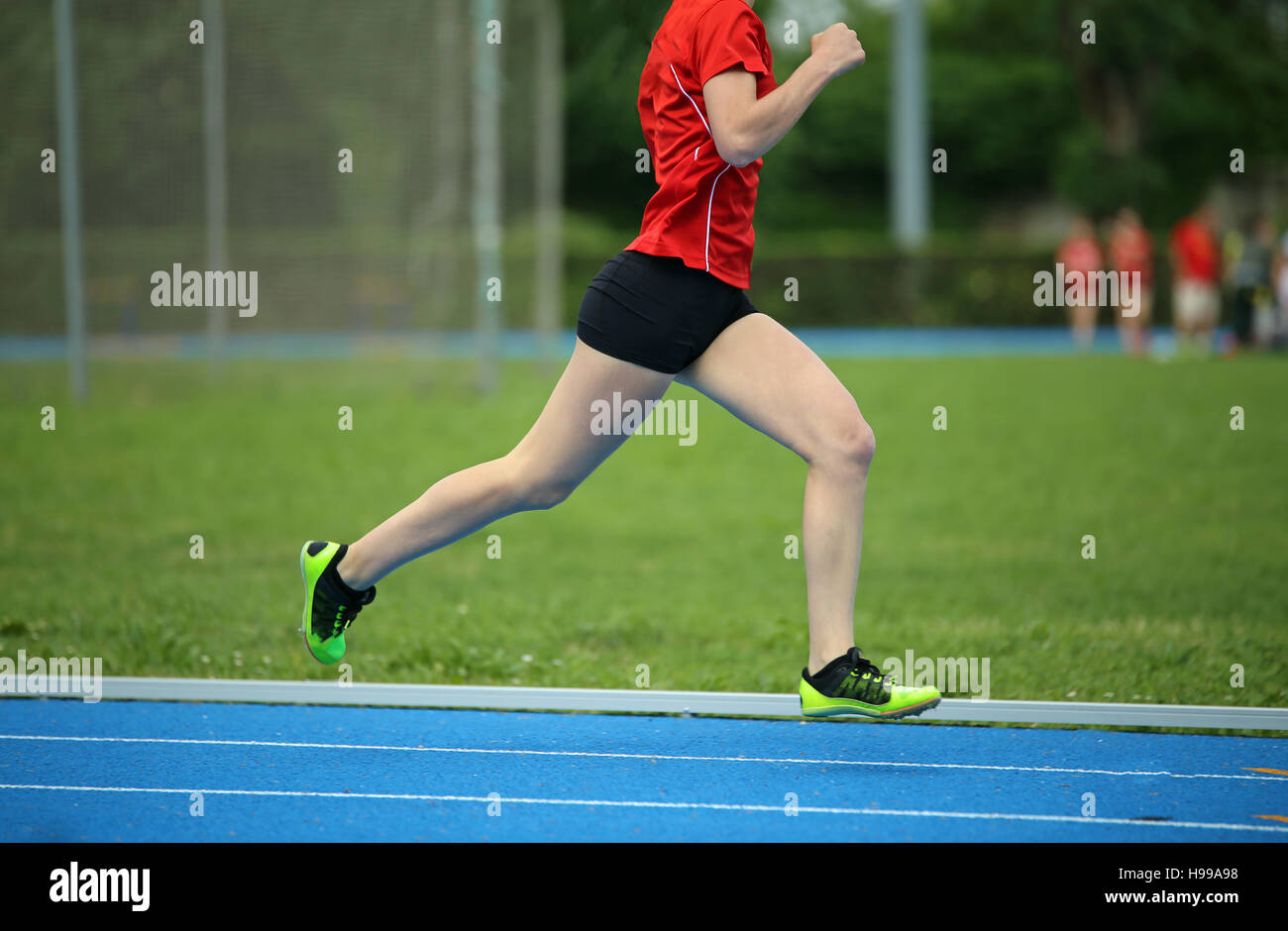 young girl runs faster on the track during a sports competition Stock ...
