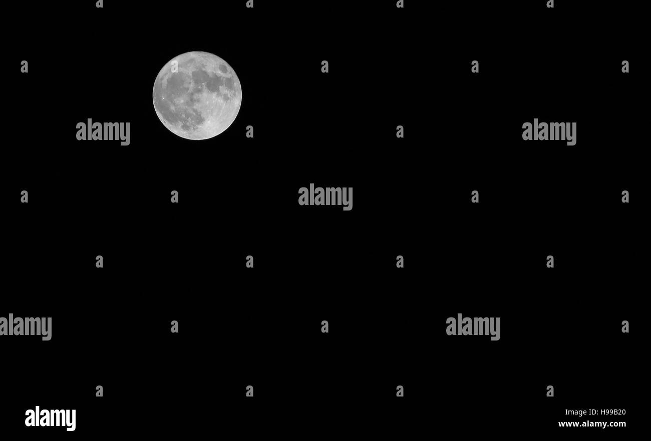 very big moon in the dark sky on a night in late autumn Stock Photo - Alamy