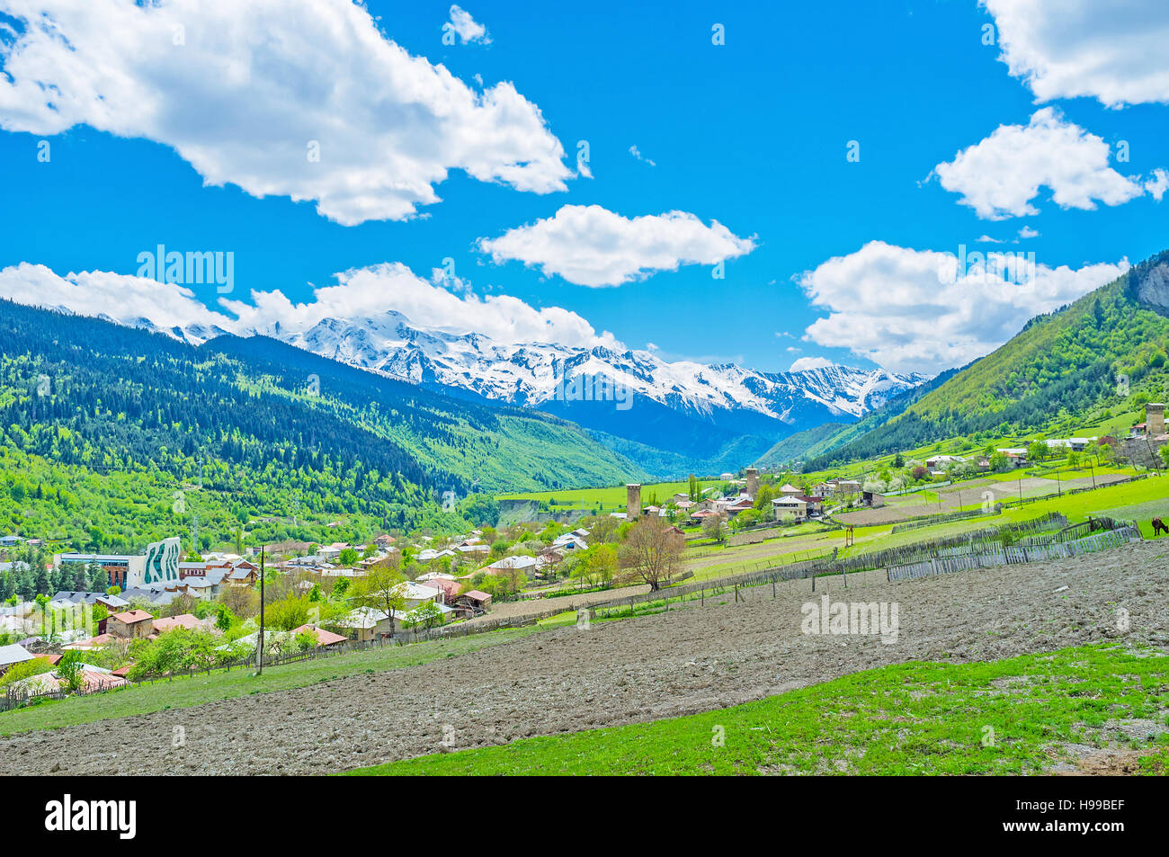 The view from the slope, covered with agriculture lands on the roofs ...