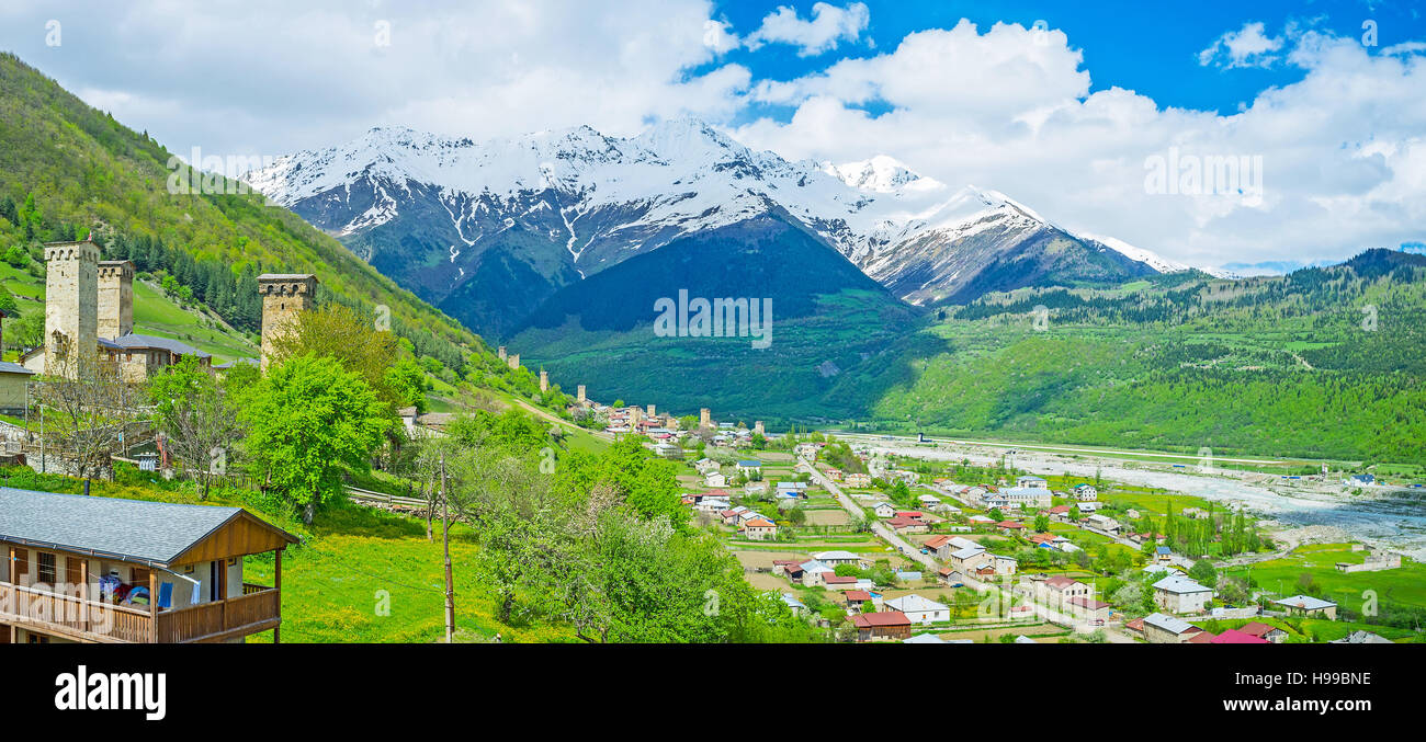 The valley of Mestiachala river with the houses and towers of Mestia ...