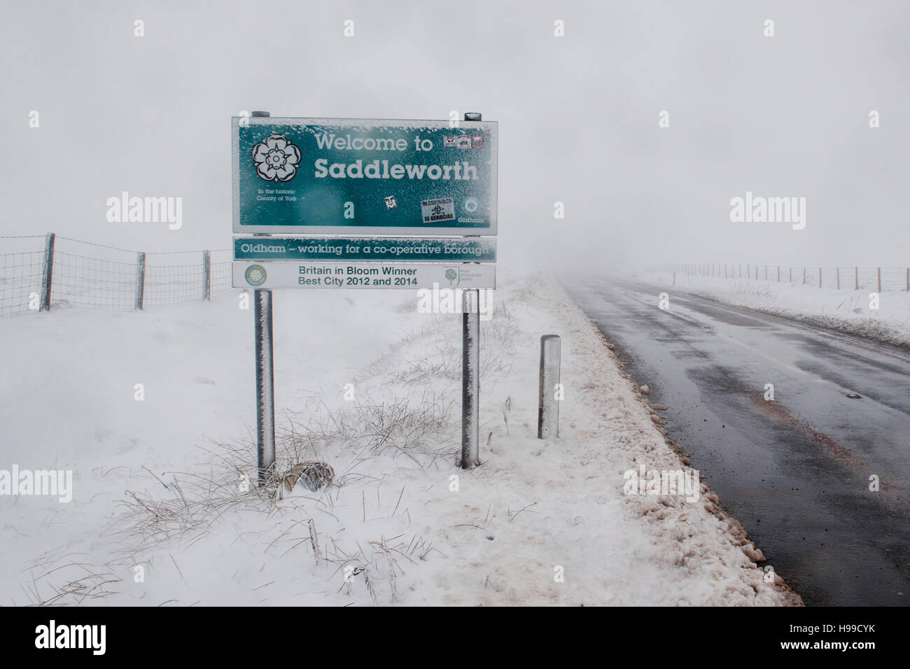 A road sign covered in snow on the A635 on Saddleworth Moor in the ...