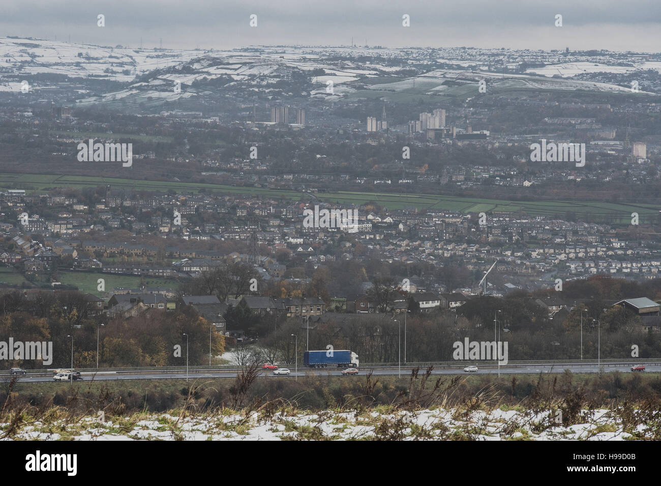 Cars travel along the M62 motorway near Huddersfield, as weather ...