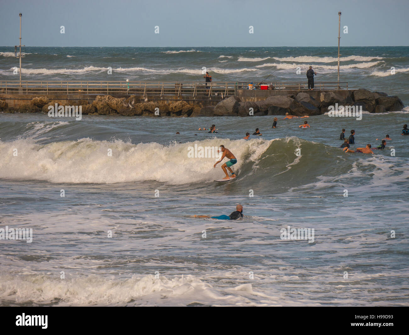 People surfing in the waves on Jupiter Beach in Florida Stock Photo - Alamy