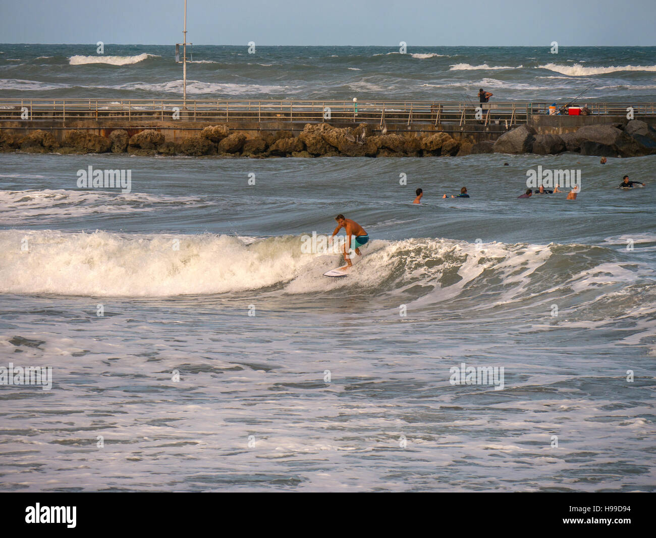 People surfing in the waves on Jupiter Beach in Florida Stock Photo - Alamy