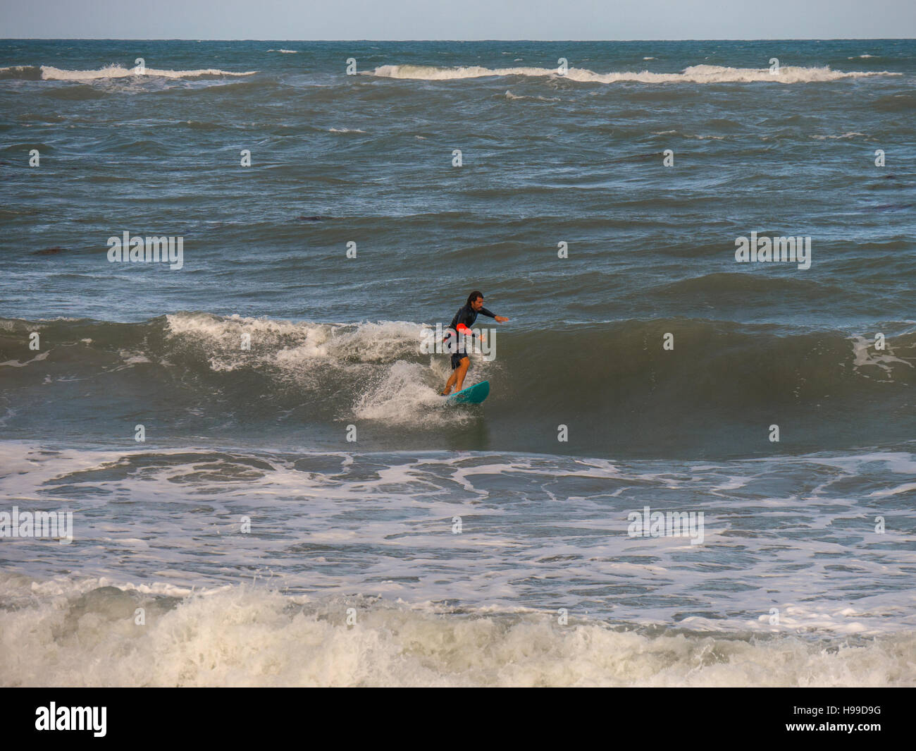 People surfing in the waves on Jupiter Beach in Florida Stock Photo - Alamy