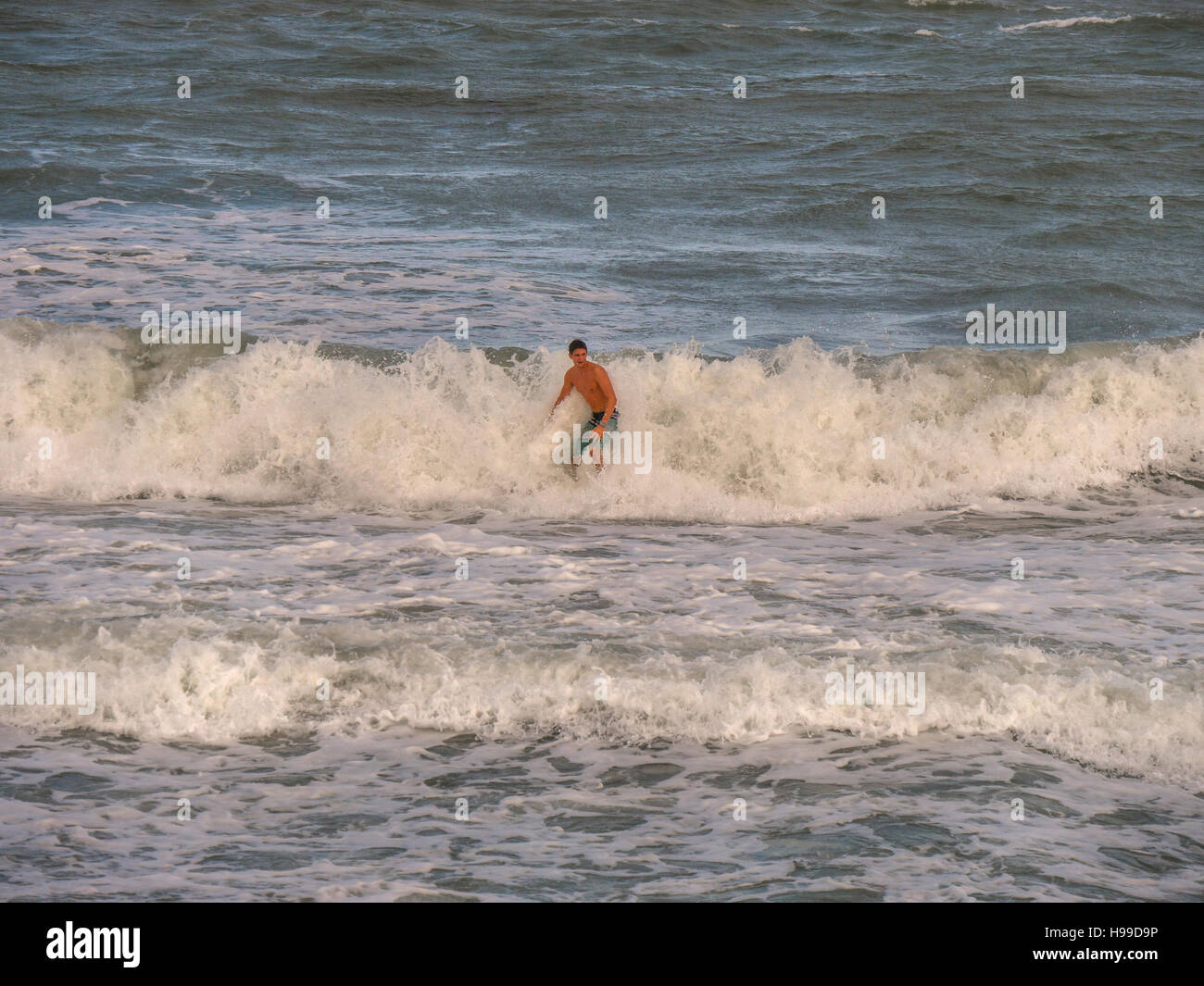 People surfing in the waves on Jupiter Beach in Florida Stock Photo - Alamy