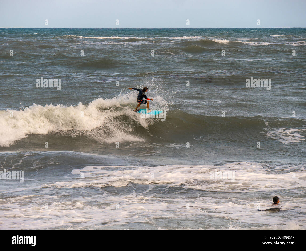 People surfing in the waves on Jupiter Beach in Florida Stock Photo - Alamy