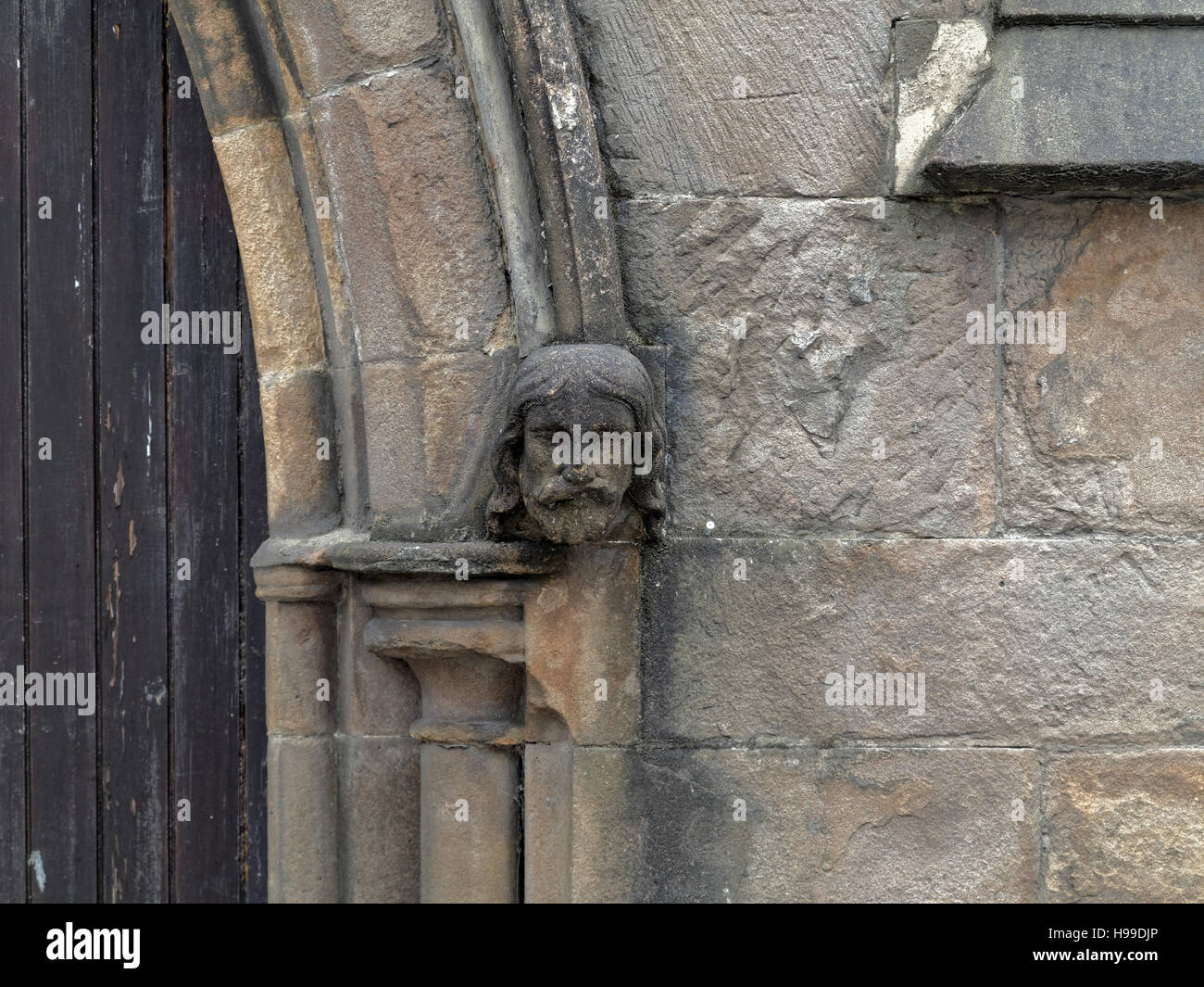 stone head of Jesus in detail of old building arch entrance Stock Photo ...