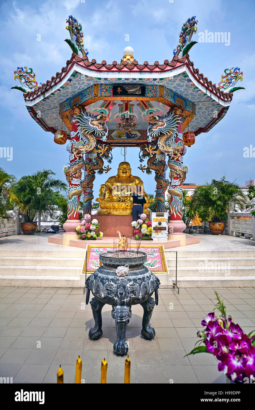 Ornate Chinese pagoda shrine housing a laughing golden Buddha. Na Klua ...