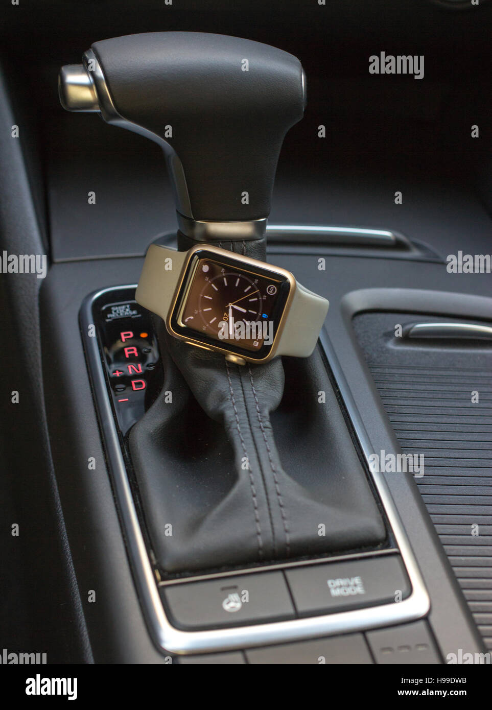 Modern car interior with smart watch on gear stick Stock Photo - Alamy