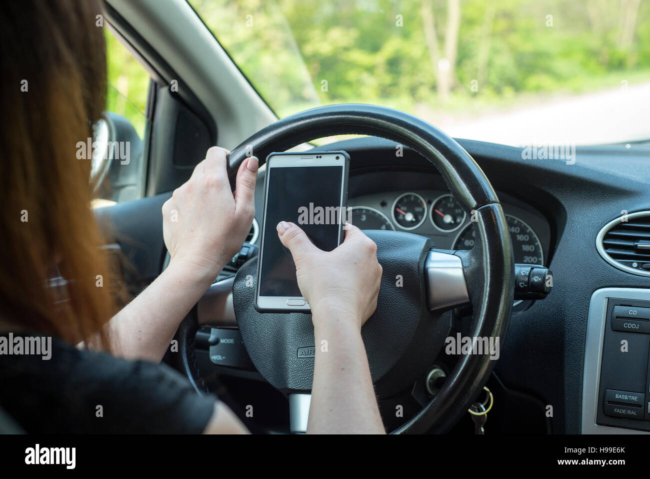 woman riding in a car and talking on the phone Stock Photo - Alamy